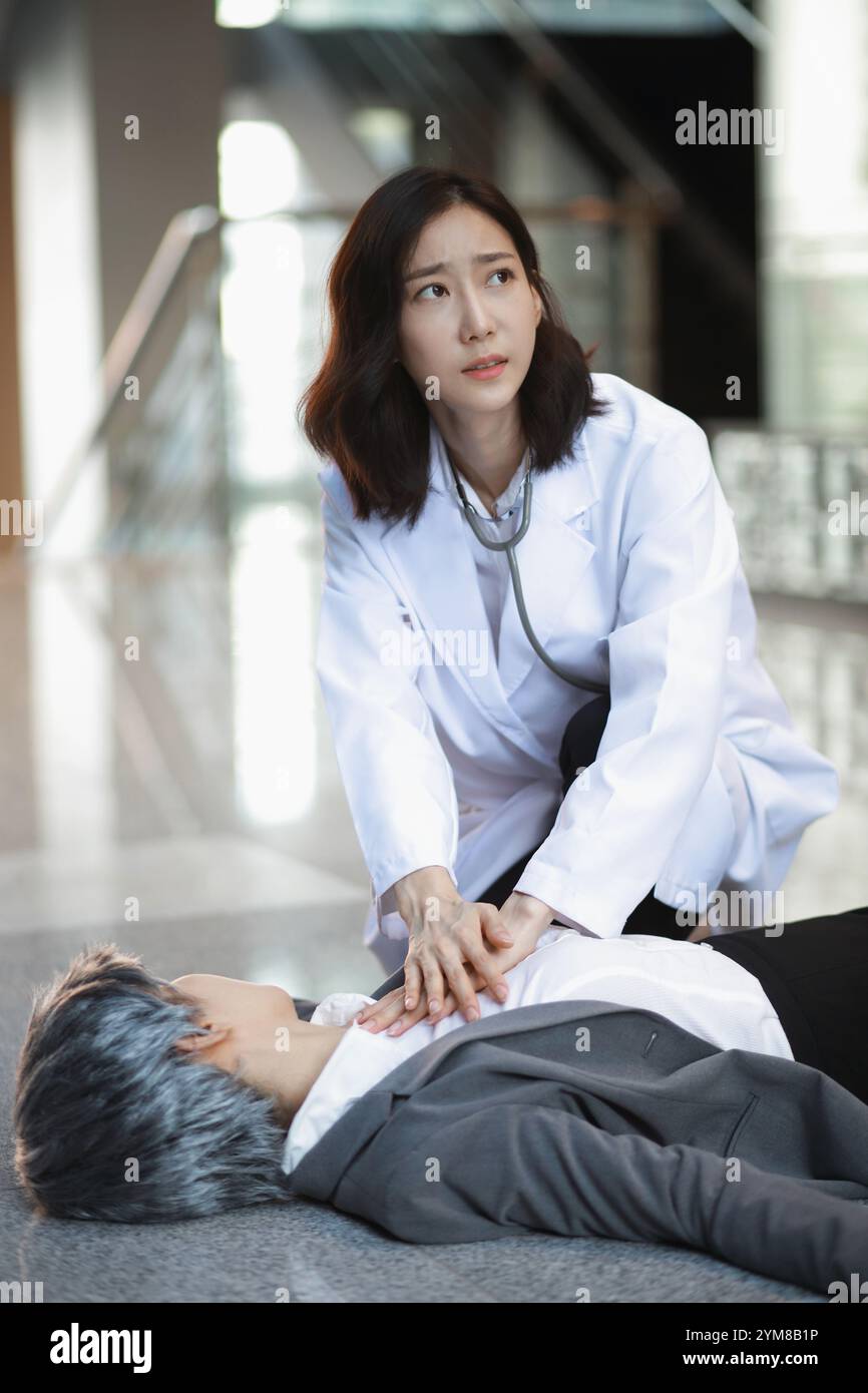 Giving first aid hi-res stock photography and images - Alamy