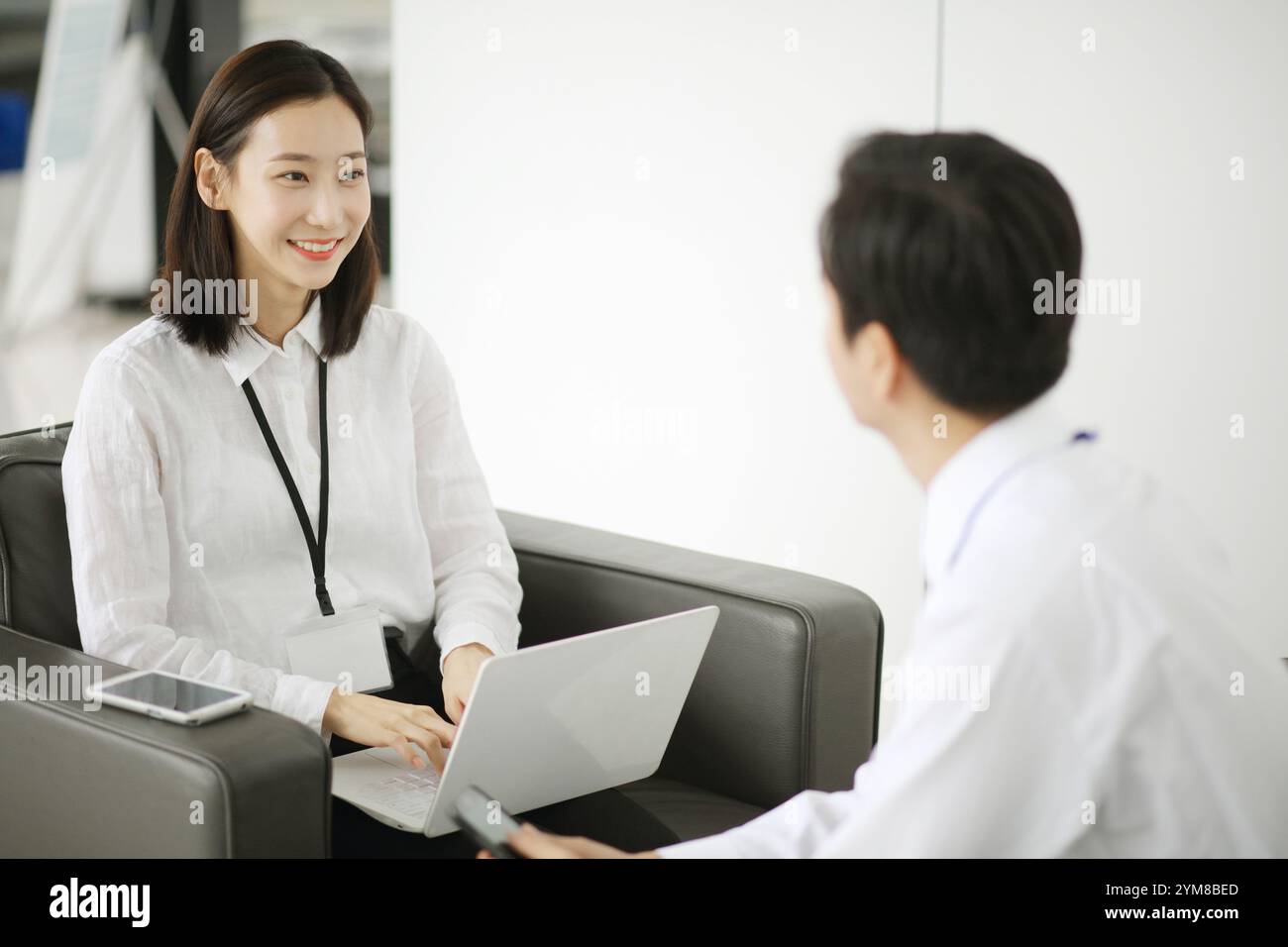 Car dealer making a sales pitch with a smile Stock Photo - Alamy