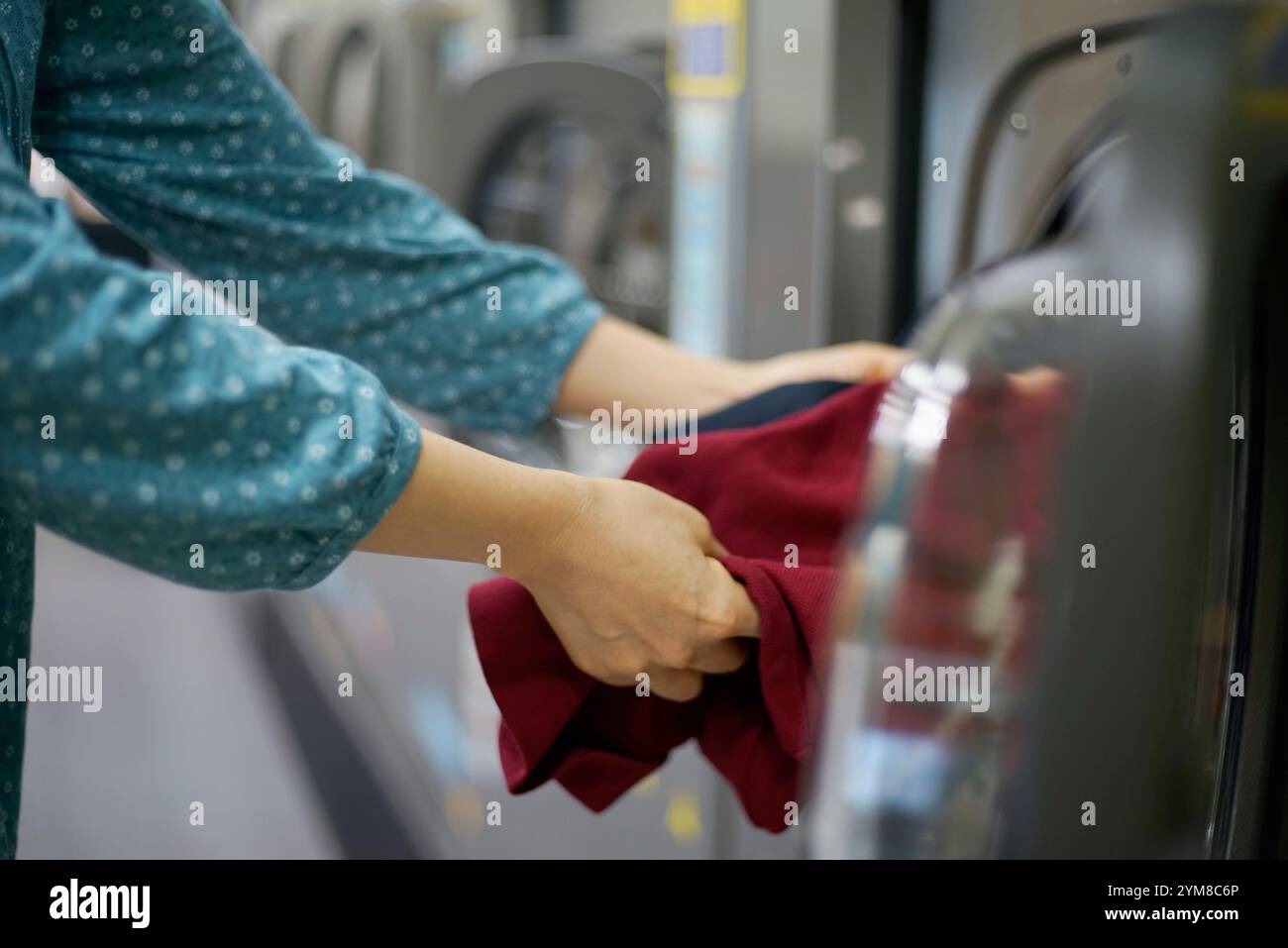 Taking clothes out washing machine hi-res stock photography and images ...