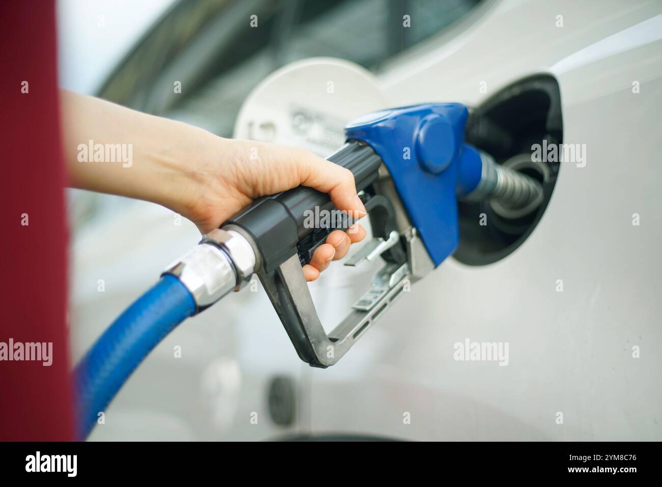 Woman refueling hi-res stock photography and images - Alamy