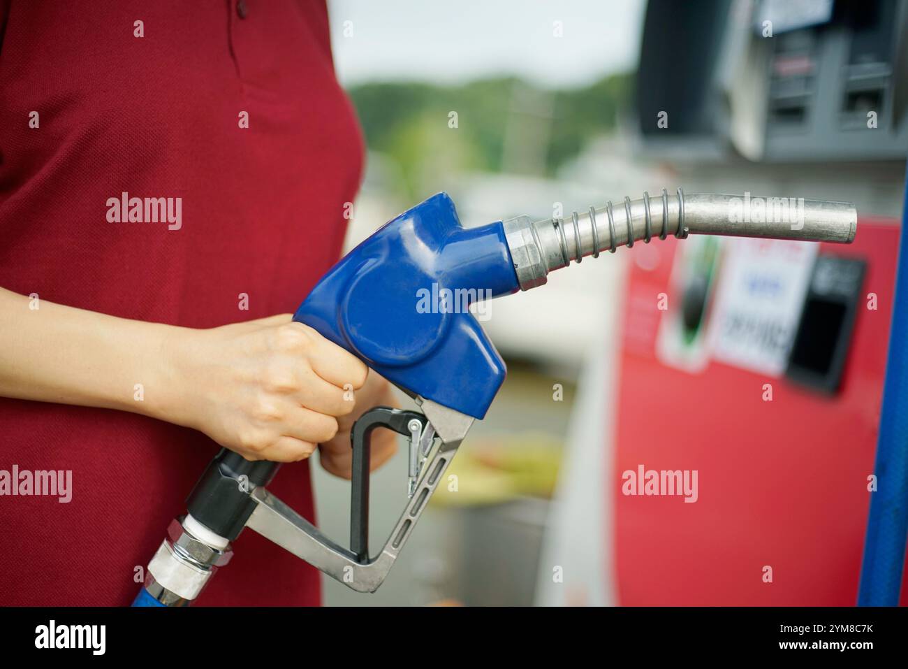 Woman refuelling machine hi-res stock photography and images - Alamy