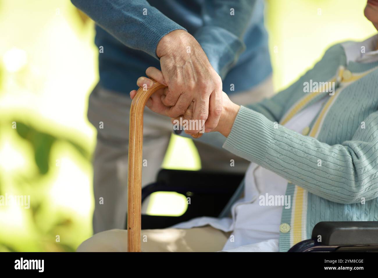 Older man holding cane Stock Photo - Alamy