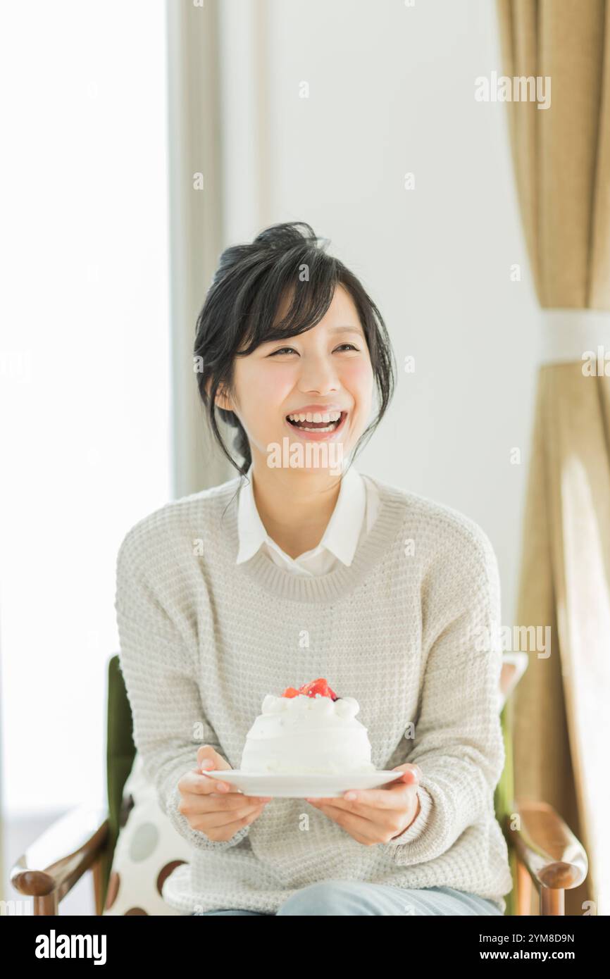 Happy women eating cake hi-res stock photography and images - Alamy