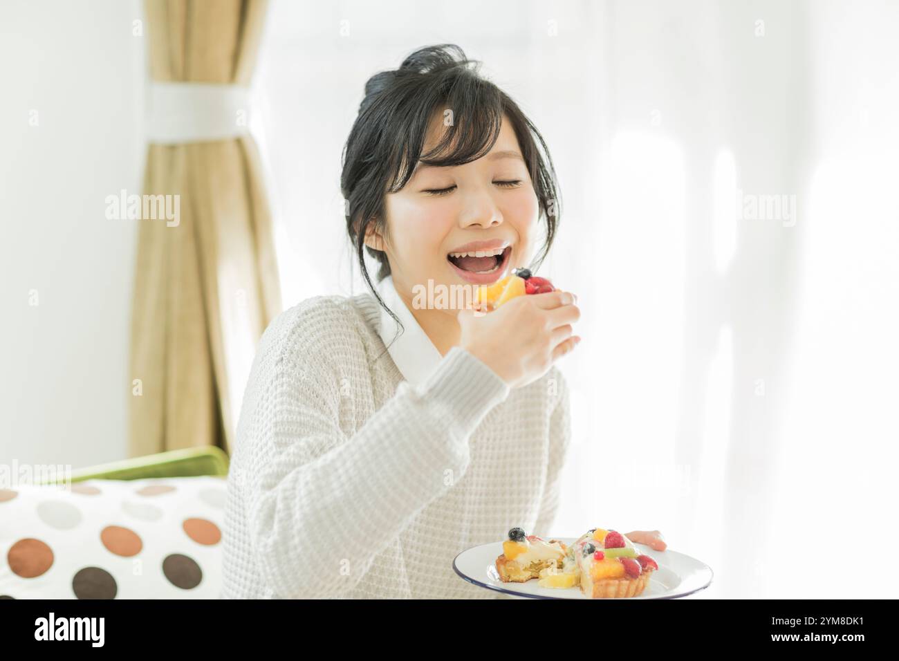 Person eating cake hi-res stock photography and images - Alamy