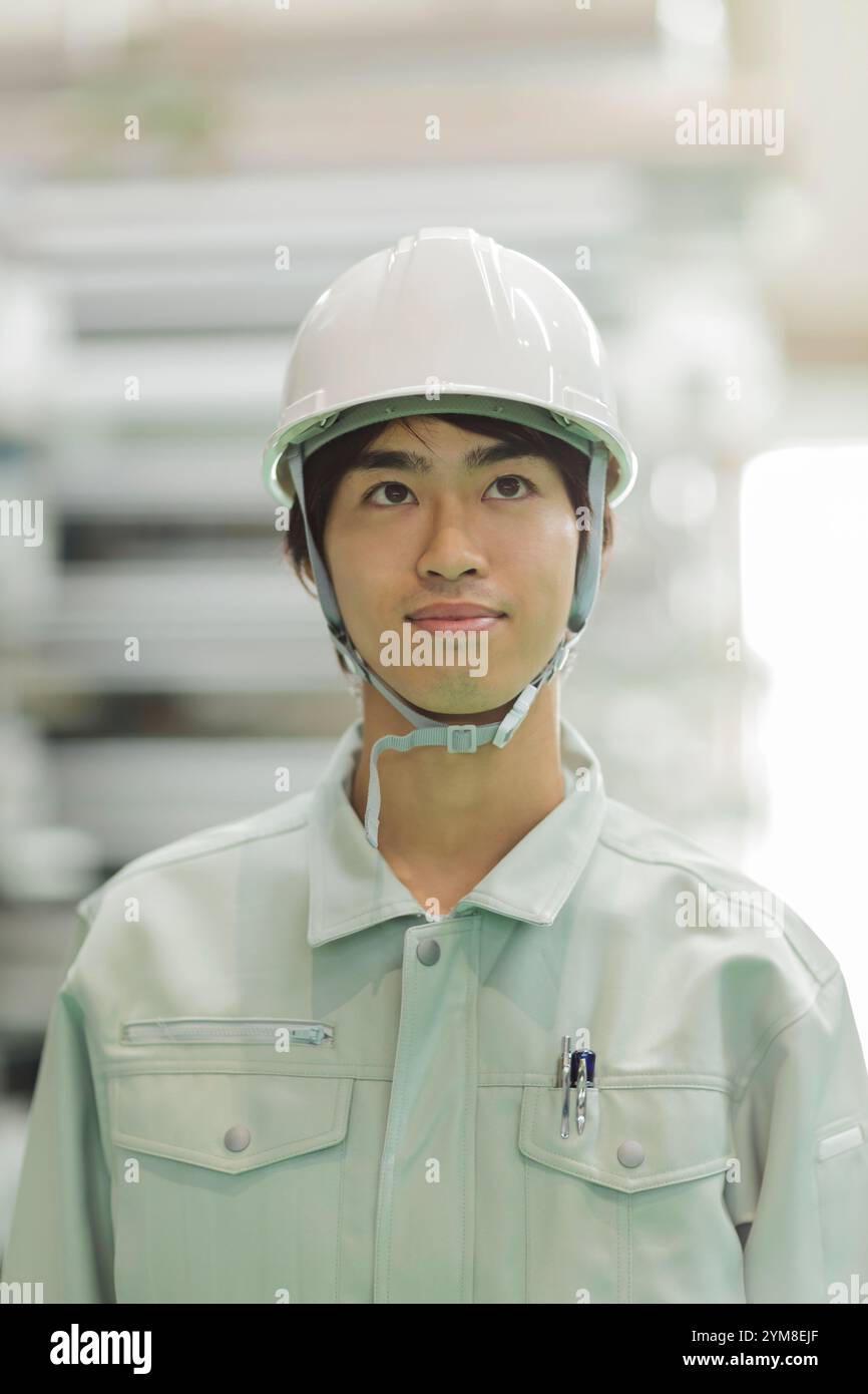 Man in work clothes hi-res stock photography and images - Alamy