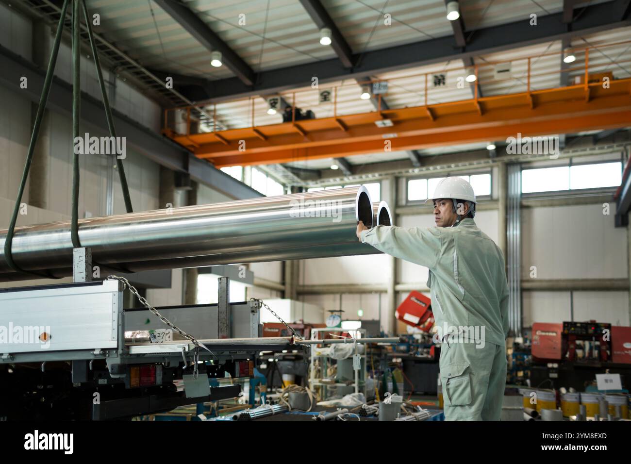 Worker man working in factory Stock Photo - Alamy
