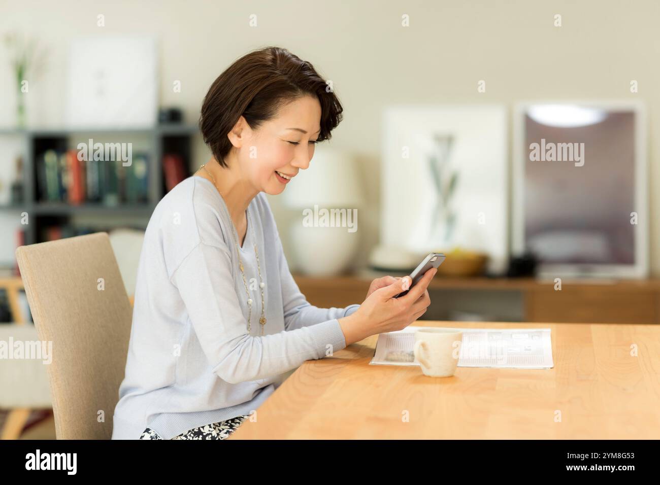 Senior women operating smartphones Stock Photo - Alamy