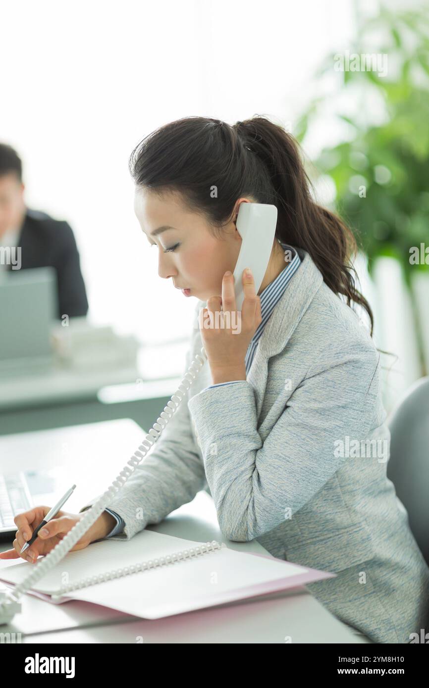 Business woman making call desk hi-res stock photography and images - Alamy