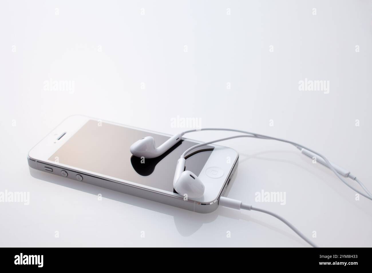 Smartphones and earphones Stock Photo - Alamy