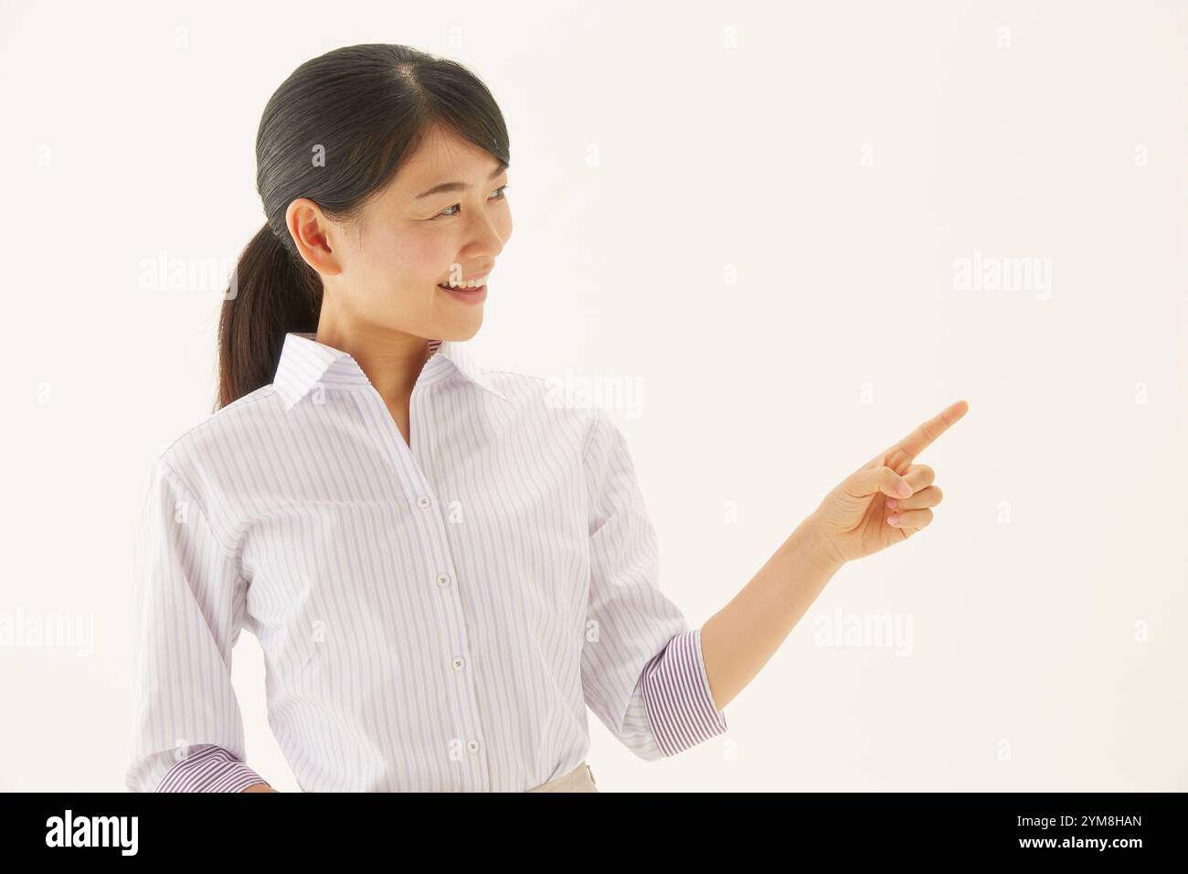 Office worker holding her hand over her head Stock Photo - Alamy