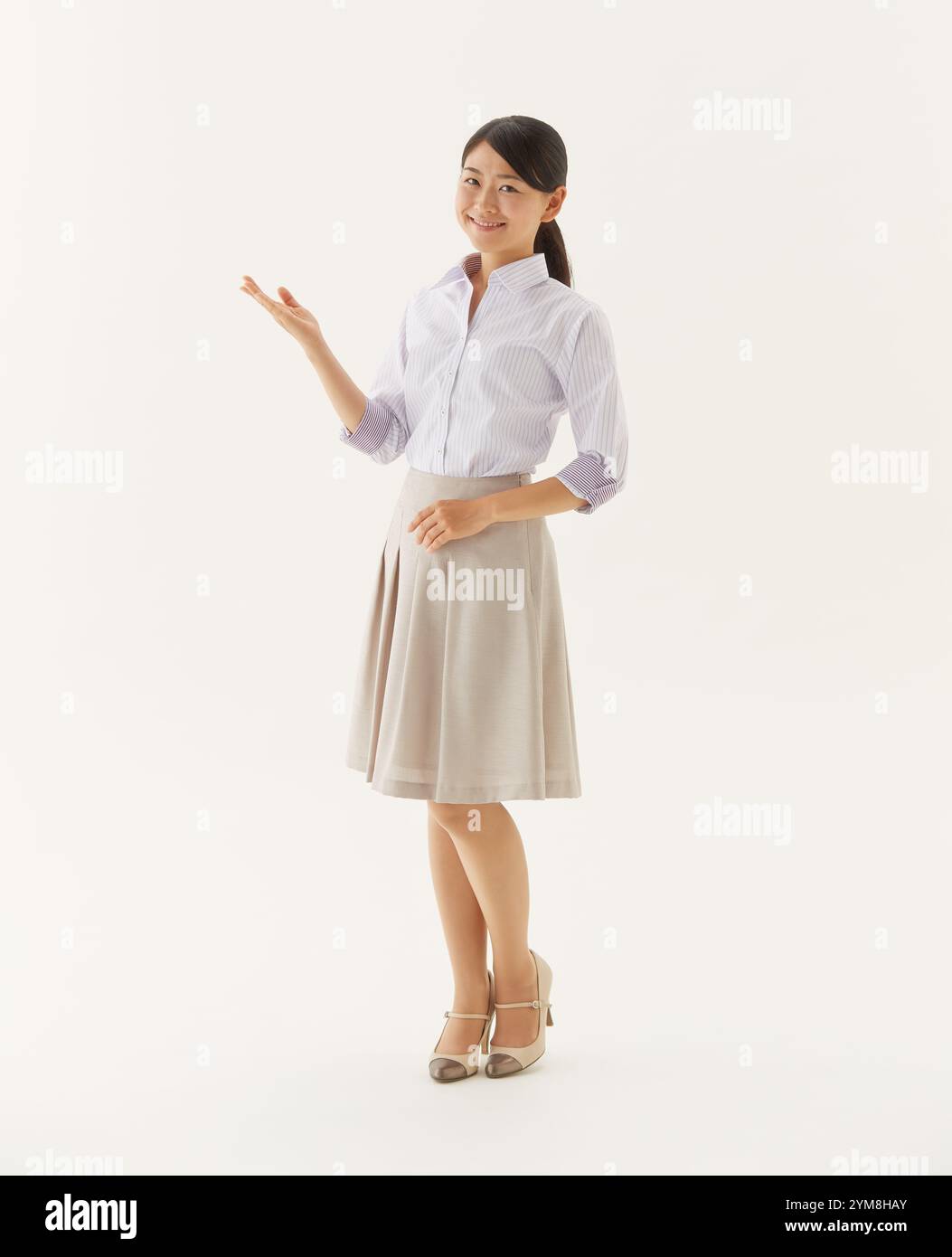 Office worker holding her hand over her head Stock Photo - Alamy