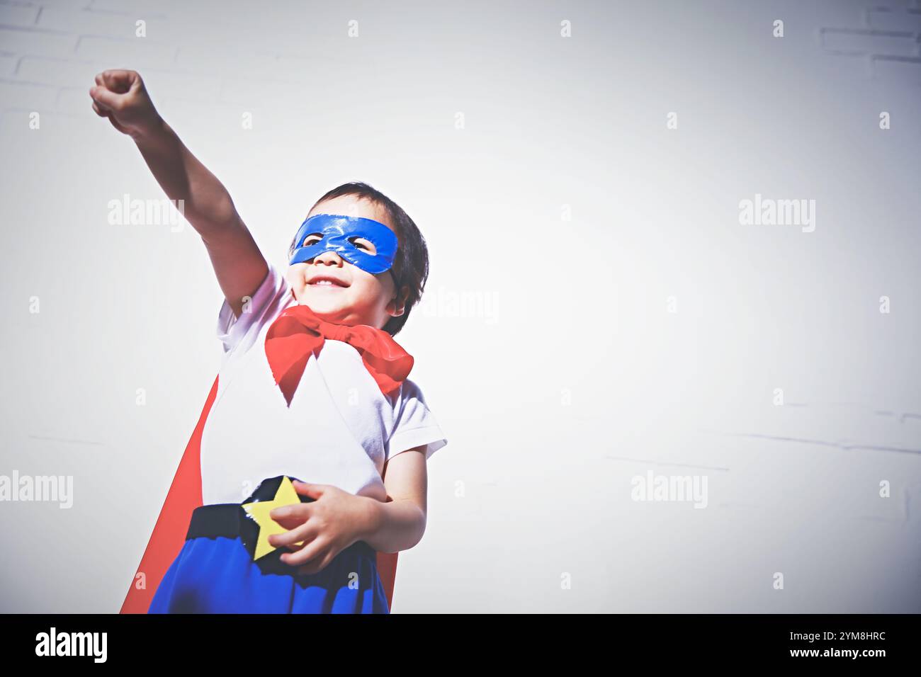 Boy pretending to be Superman Stock Photo - Alamy