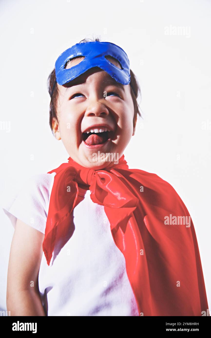 Boy joking around dressed as Superman Stock Photo - Alamy