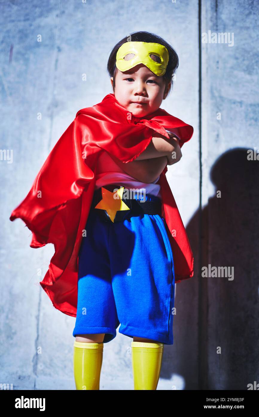 Little Superman in his signature pose Stock Photo - Alamy
