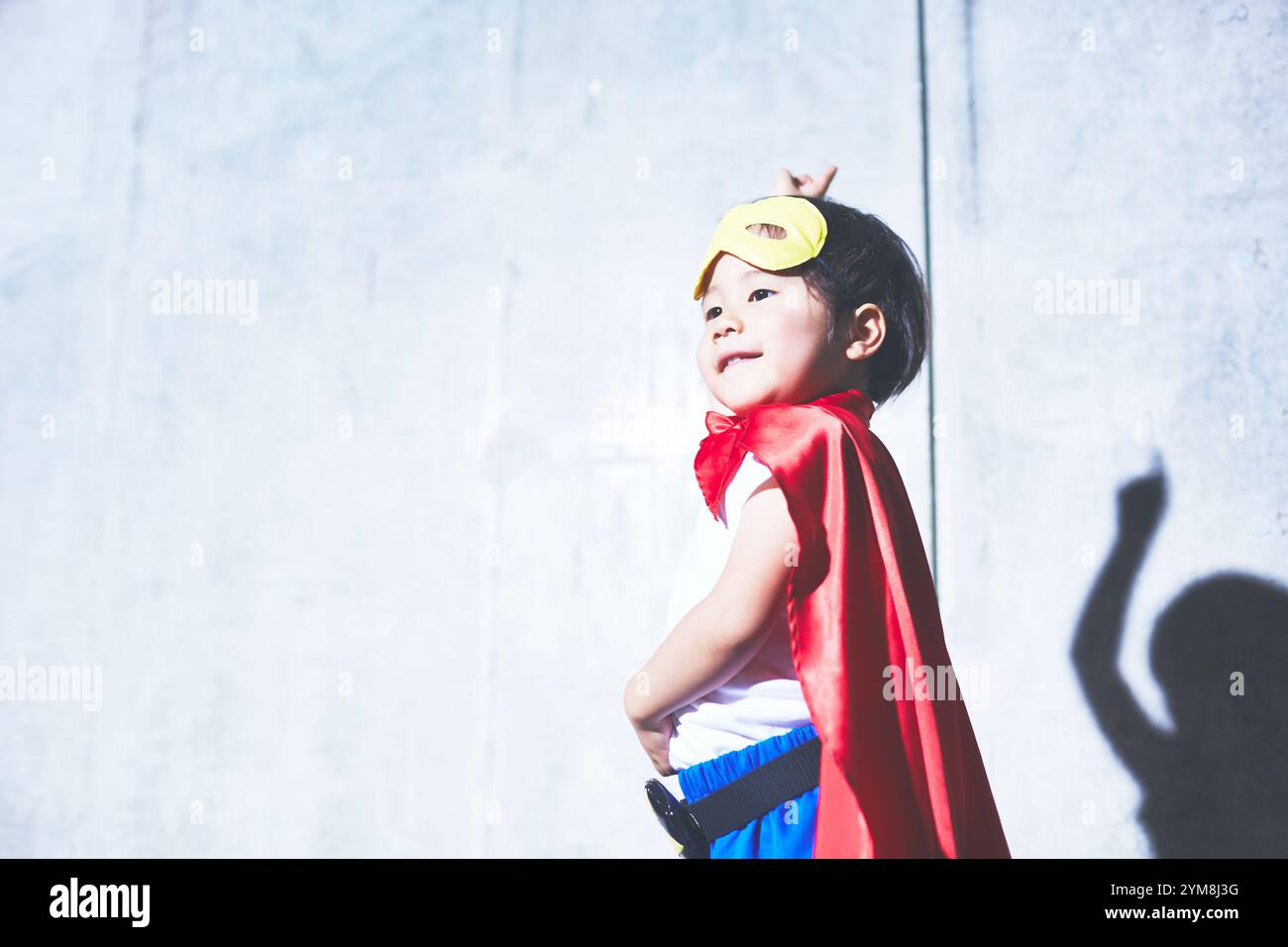 Little Superman in his signature pose Stock Photo - Alamy