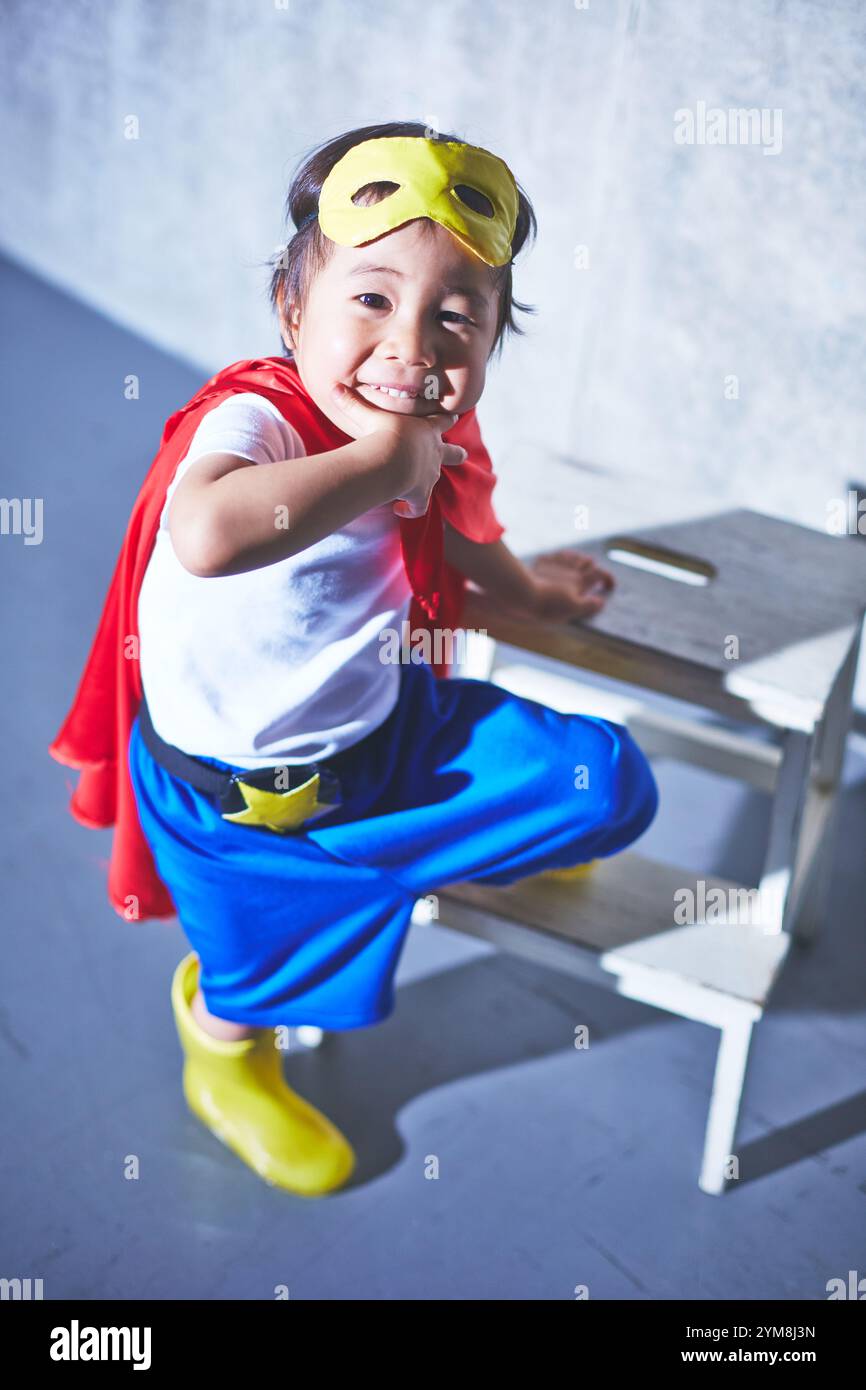 Little Superman in his signature pose Stock Photo - Alamy