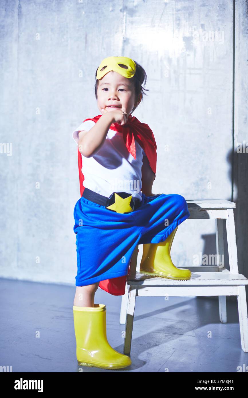 Little Superman in his signature pose Stock Photo - Alamy
