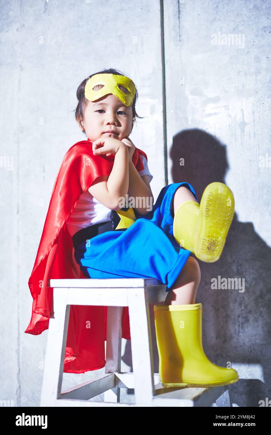Little Superman in his signature pose Stock Photo - Alamy