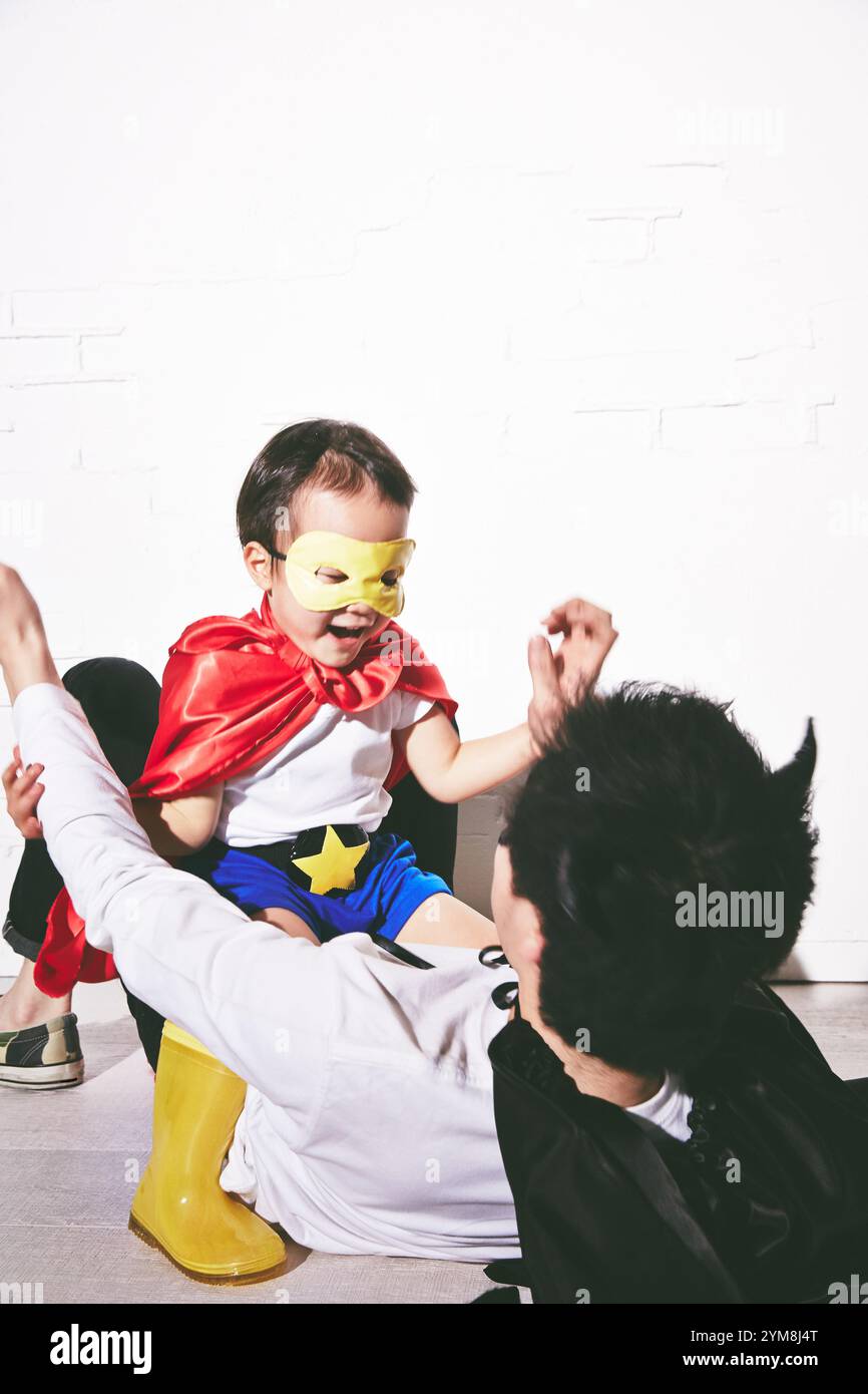 Hero boy fighting off bad guys Stock Photo - Alamy