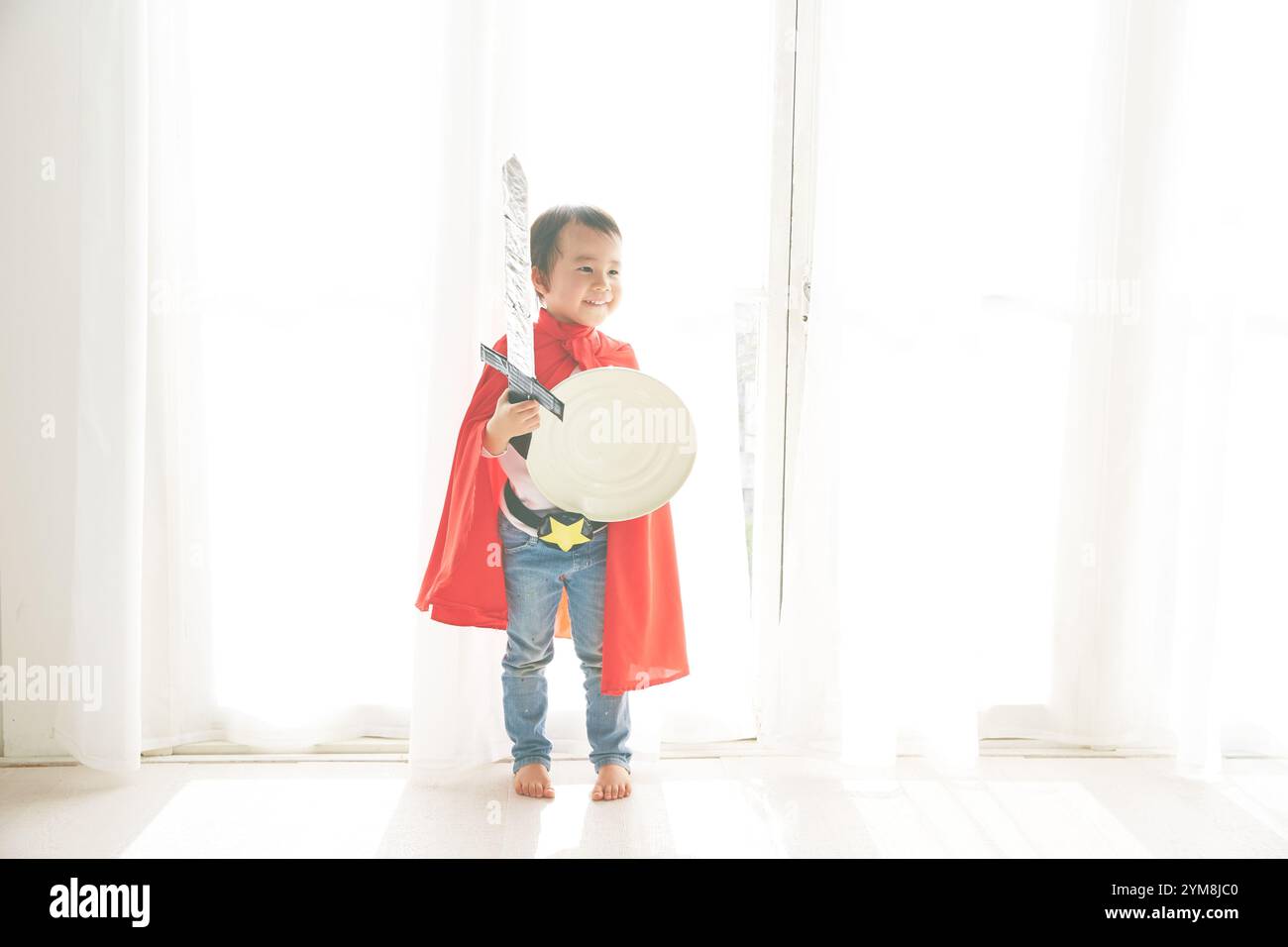 Hero boy fighting on windowsill Stock Photo - Alamy