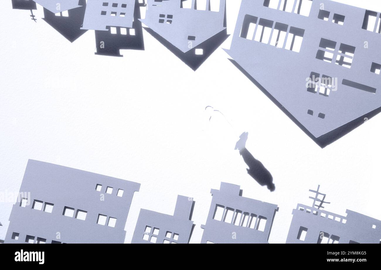 Shadow puppet people and town Stock Photo - Alamy