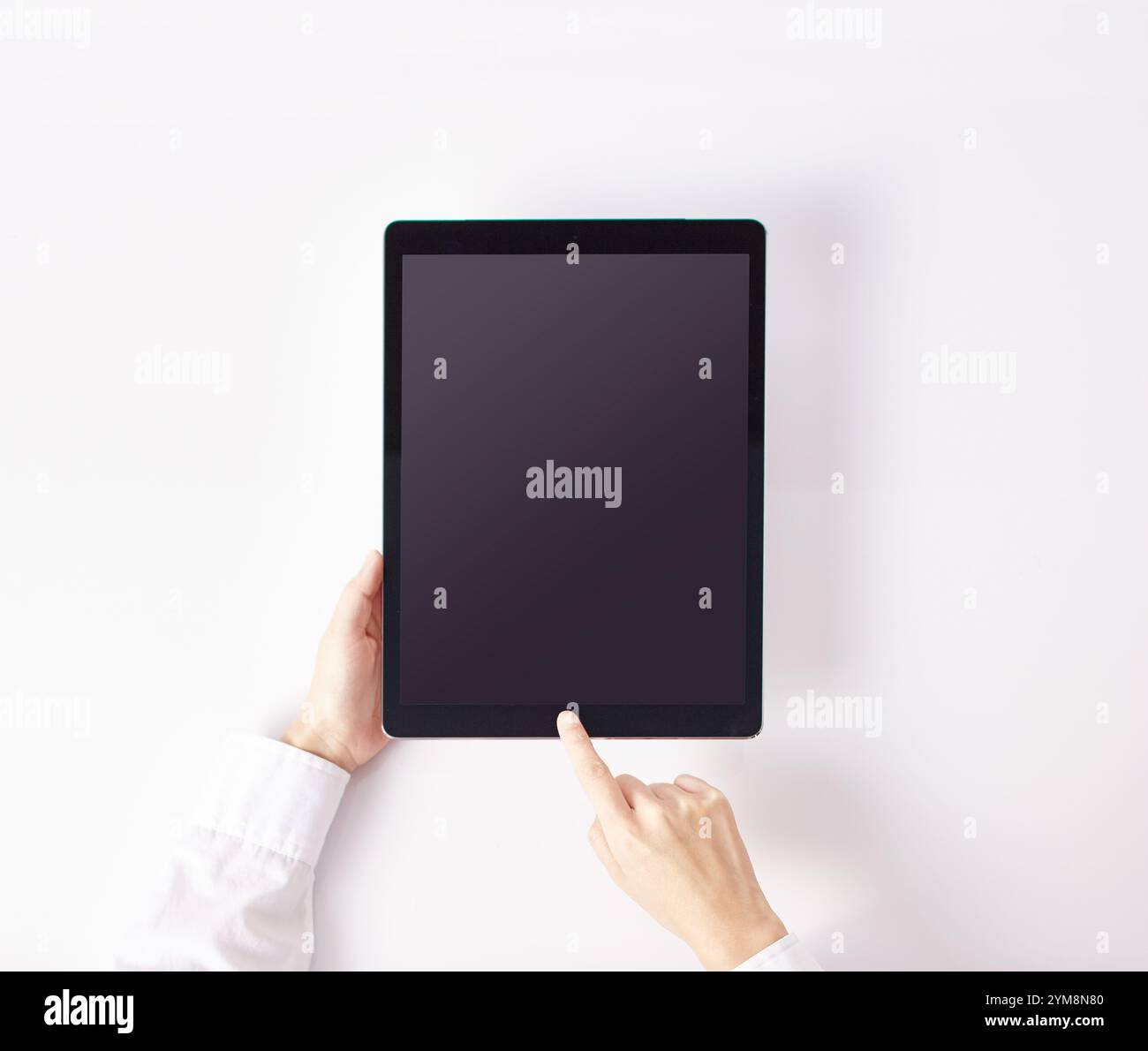 Hands operating a tablet Stock Photo - Alamy