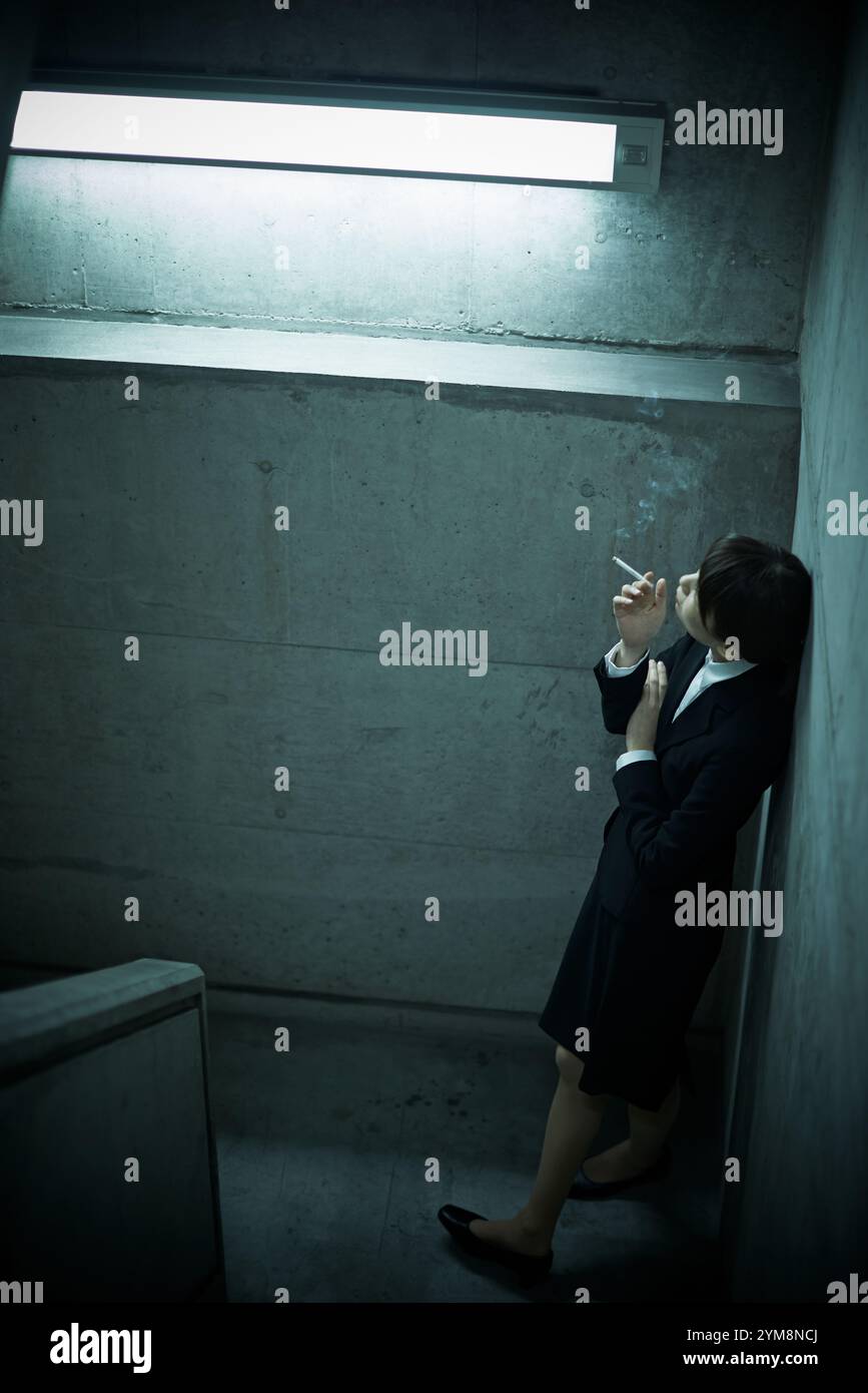 Smoking cigarette break office woman hi-res stock photography and ...