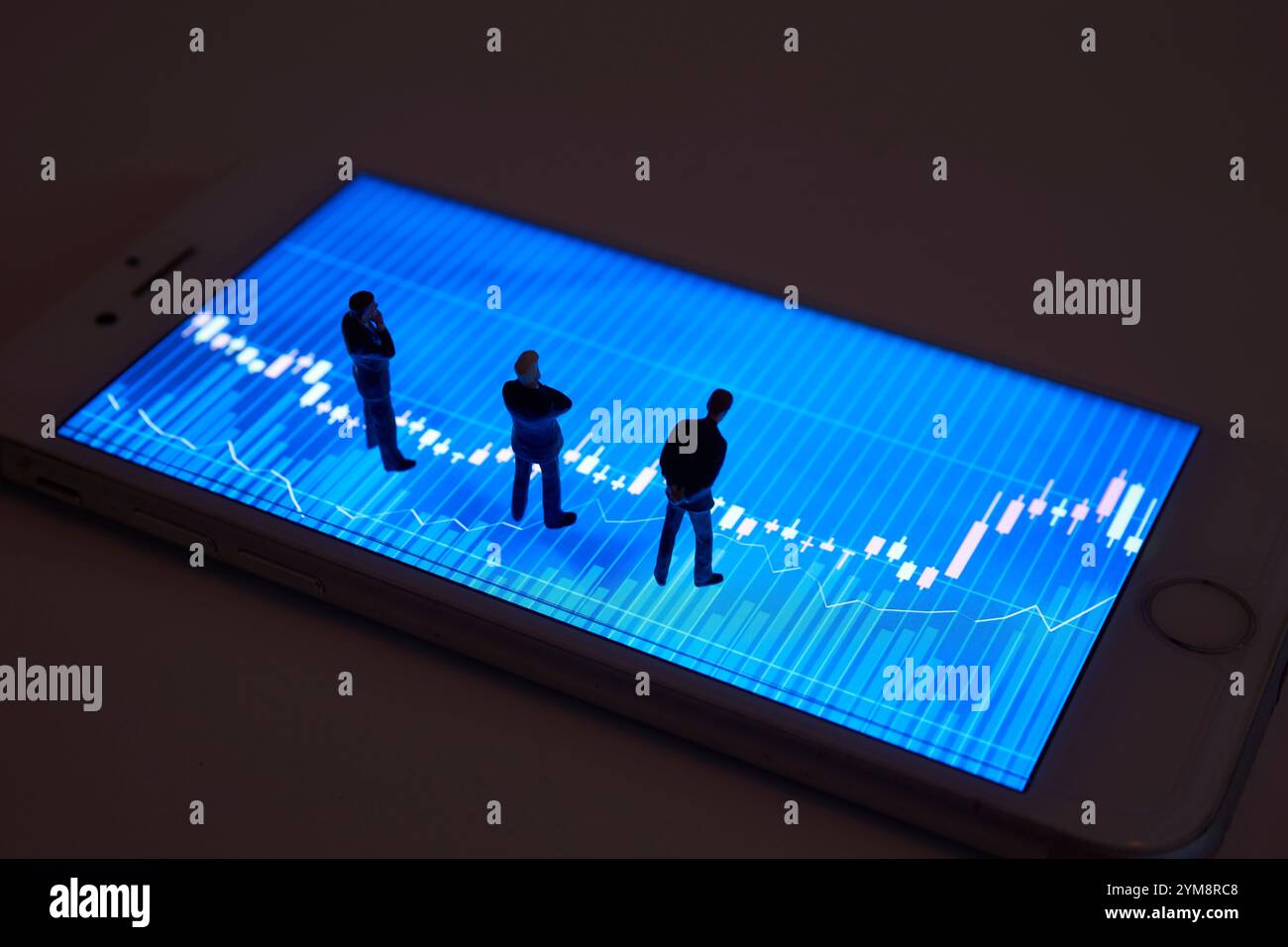 Stock graph and miniature dolls Stock Photo - Alamy