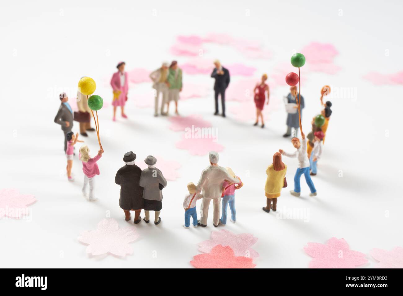 Miniature doll in a circle with cherry blossoms Stock Photo - Alamy