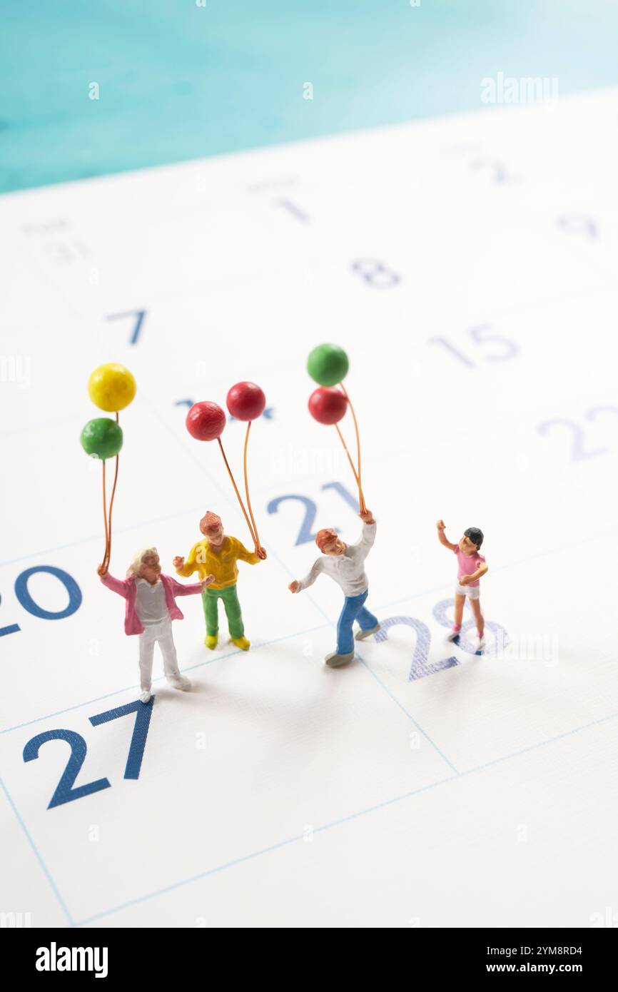 Calendar and miniature dolls Stock Photo - Alamy