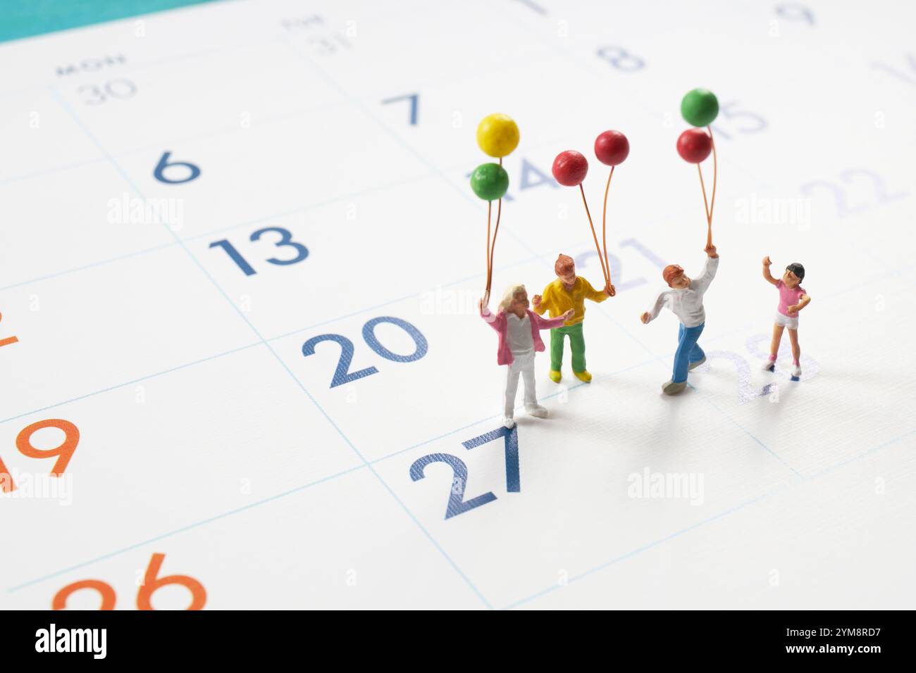 Calendar and miniature dolls Stock Photo - Alamy