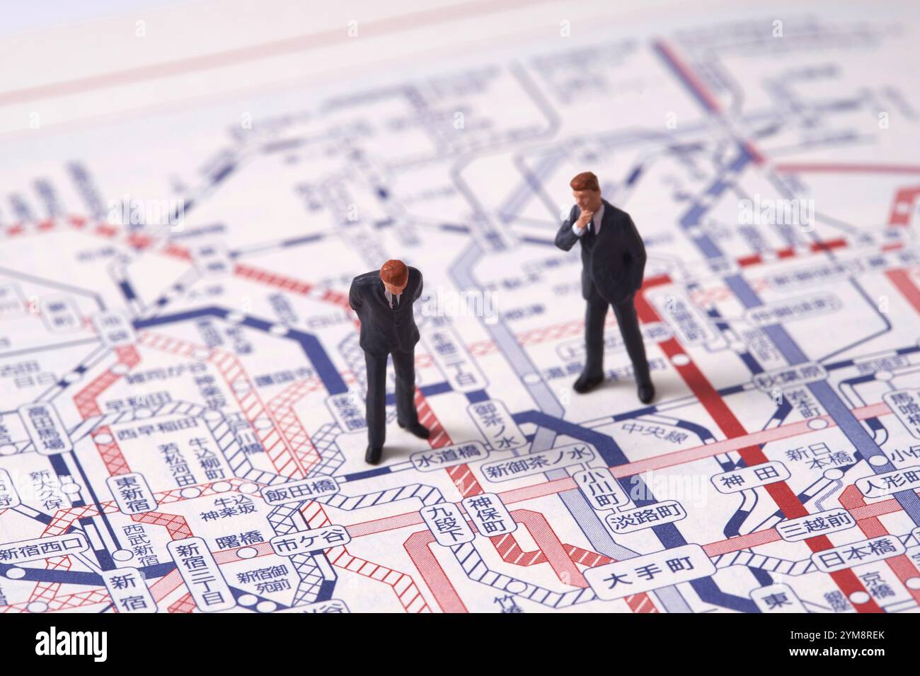 Miniature businessman doll and route map Stock Photo - Alamy