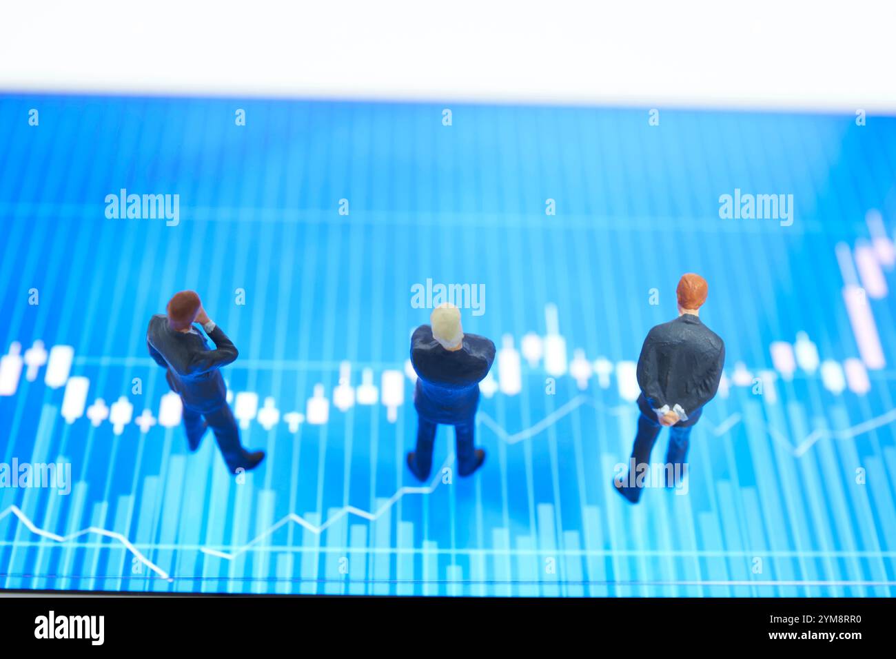 Stock graph and miniature dolls Stock Photo - Alamy