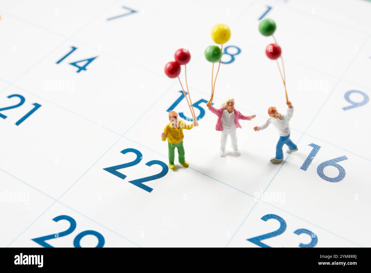Calendar and miniature dolls Stock Photo - Alamy