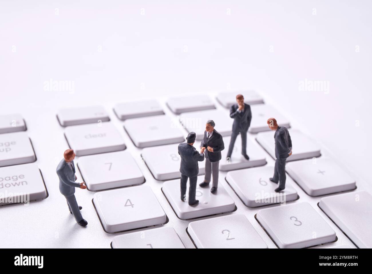 Keyboard and miniature doll Stock Photo - Alamy