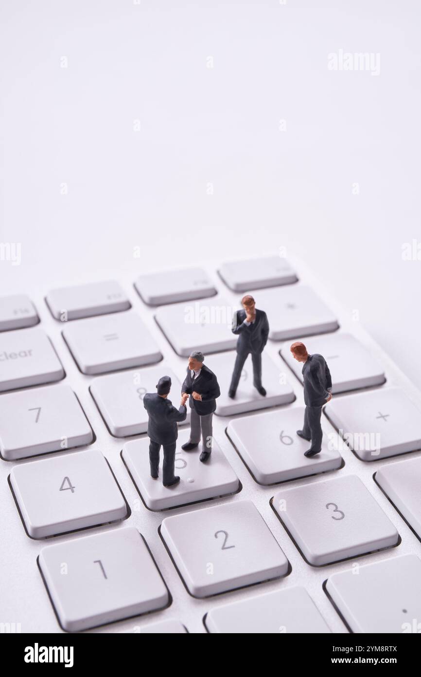 Keyboard and miniature doll Stock Photo - Alamy