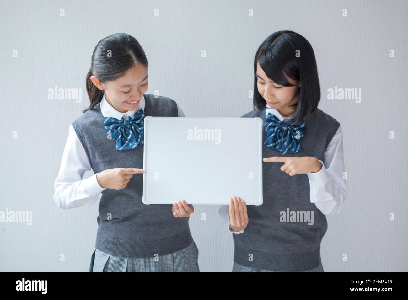 Female student with message board Stock Photo - Alamy