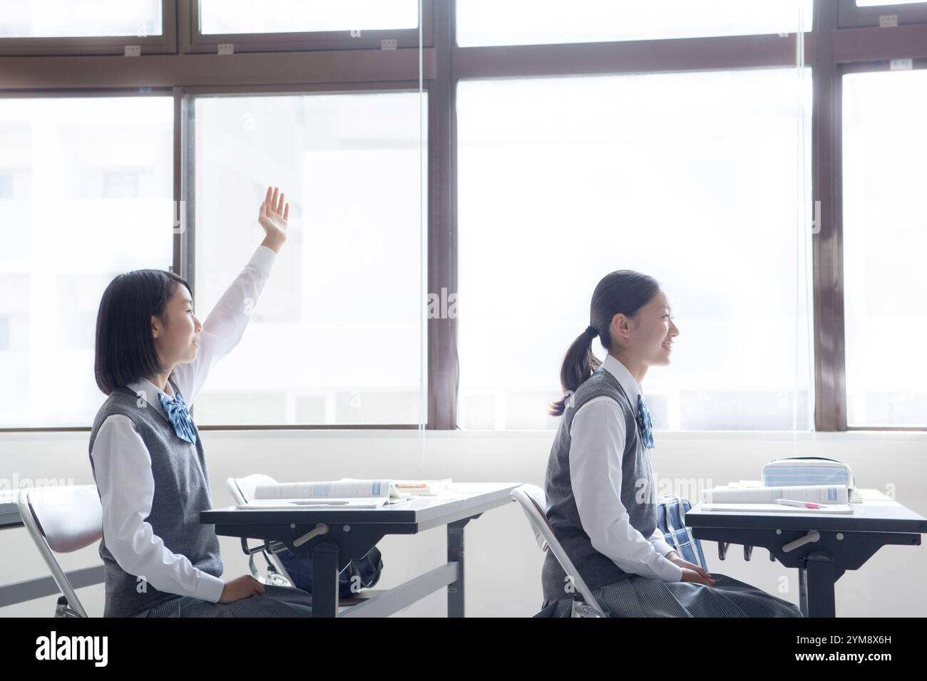 Female students taking a class Stock Photo - Alamy