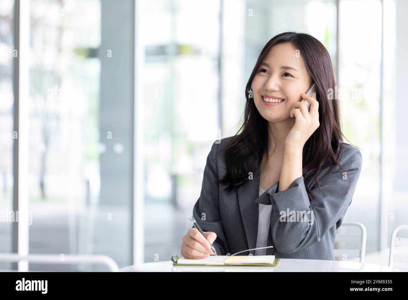 Businesswoman making a phone call Stock Photo - Alamy