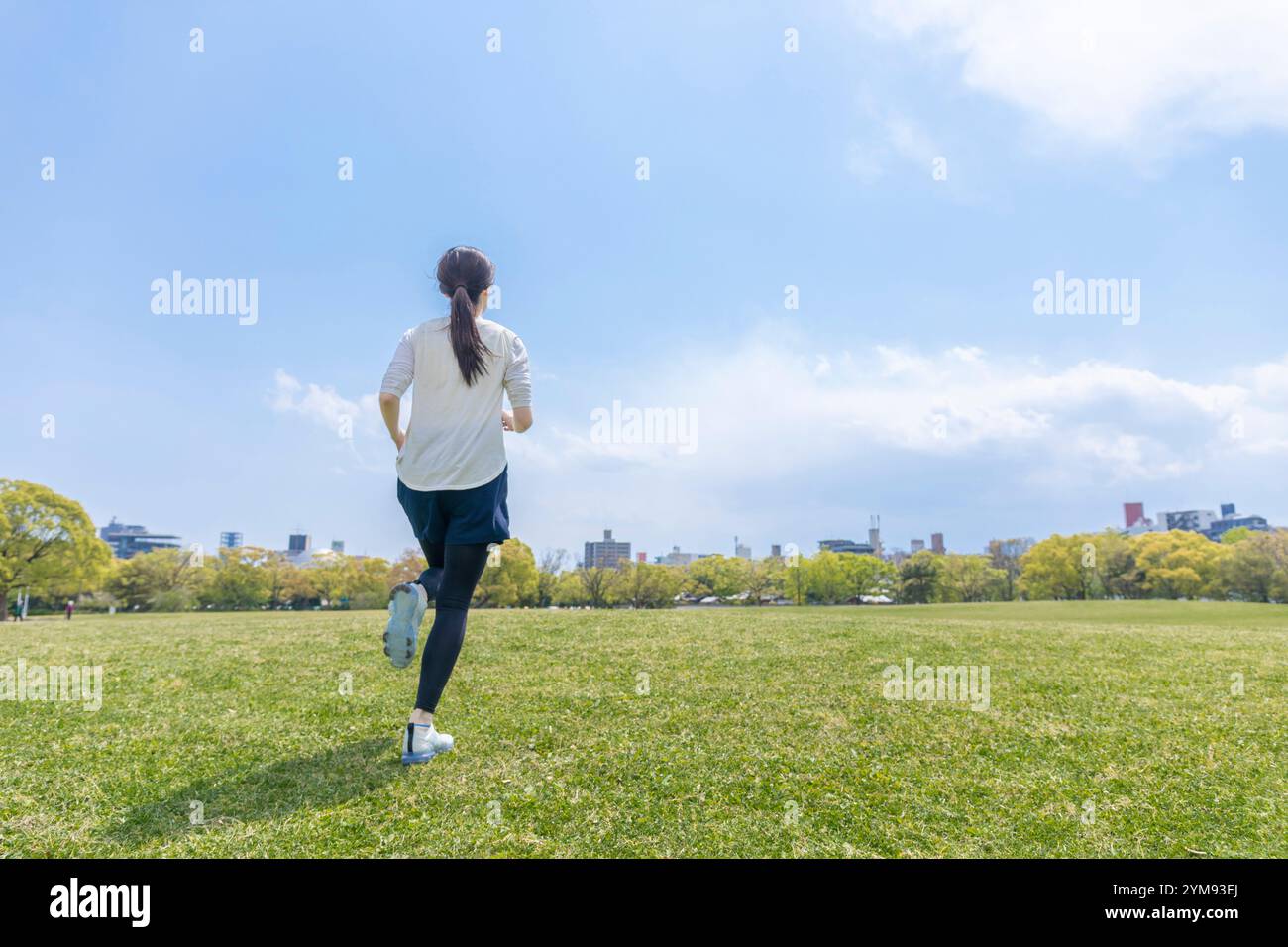 Back view jogging young hi-res stock photography and images - Alamy