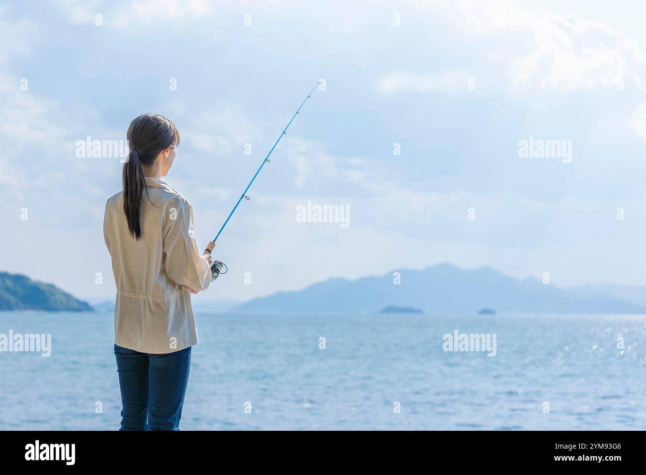 Woman enjoying view on seaside hi-res stock photography and images - Alamy