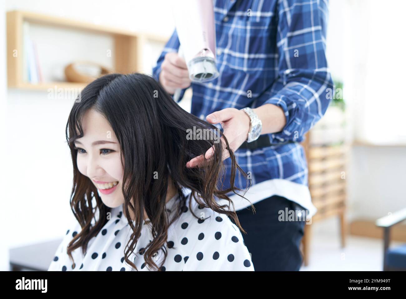 Fresh hairdresser cutting hair at a beauty salon Stock Photo - Alamy
