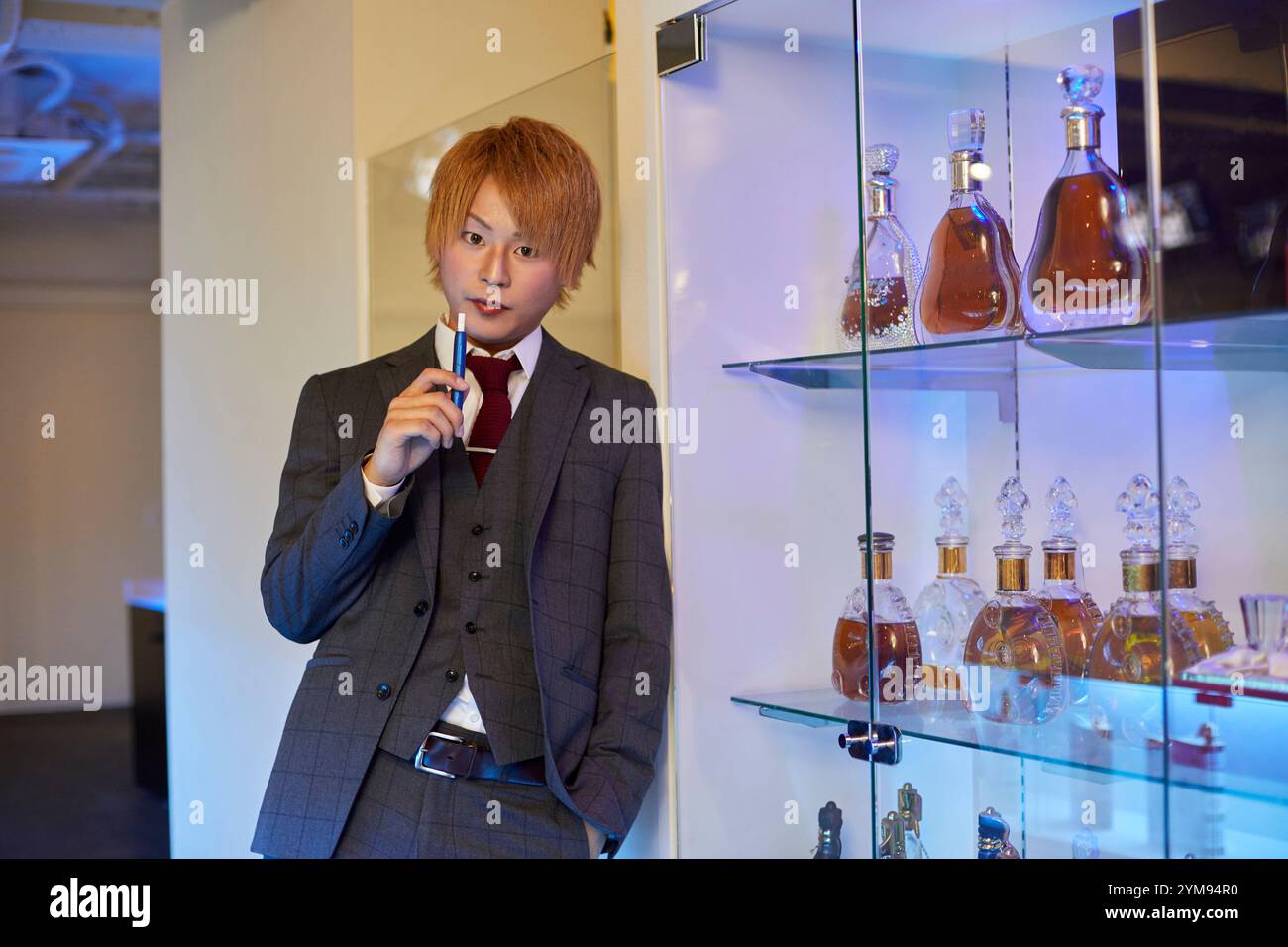 Very cool young Japanese host Stock Photo - Alamy