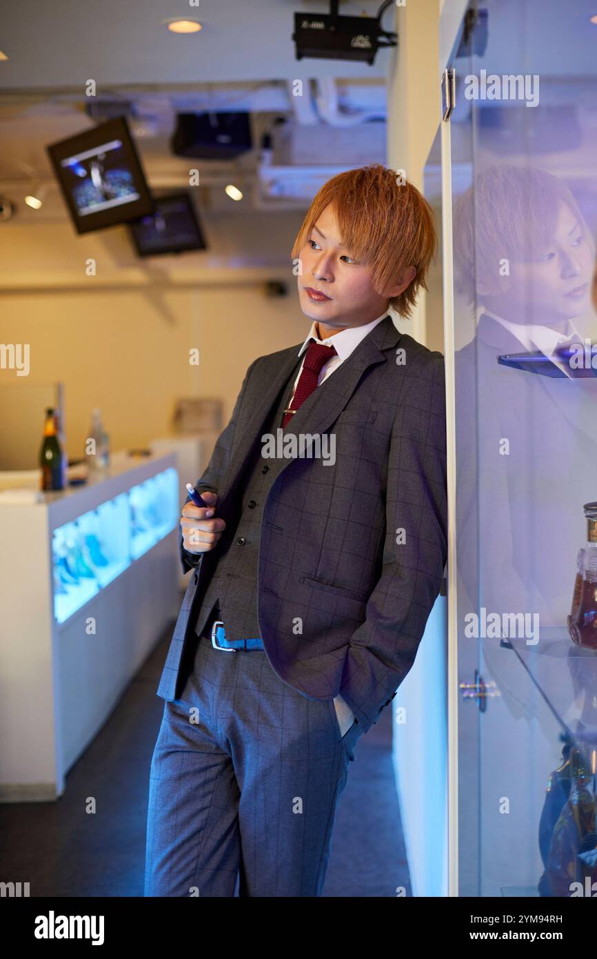 Very cool young Japanese host Stock Photo - Alamy