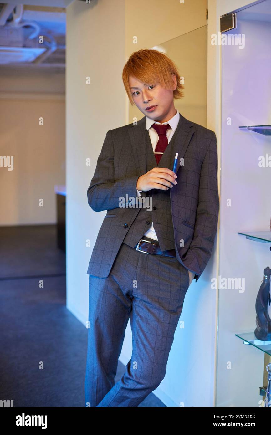 Very cool young Japanese host Stock Photo - Alamy