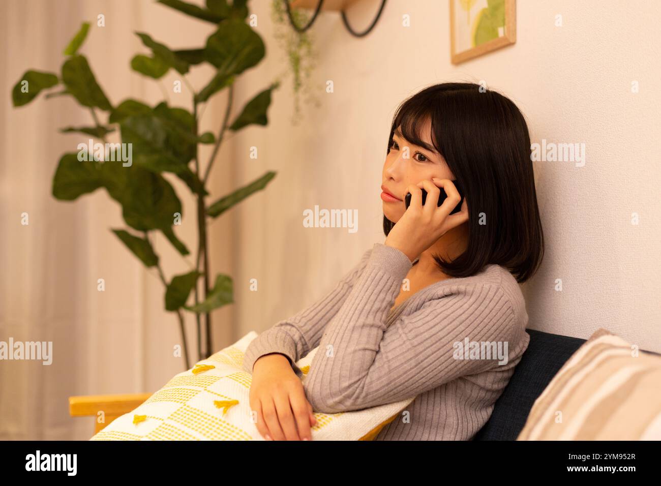 Relaxing sofa phone night hi-res stock photography and images - Alamy