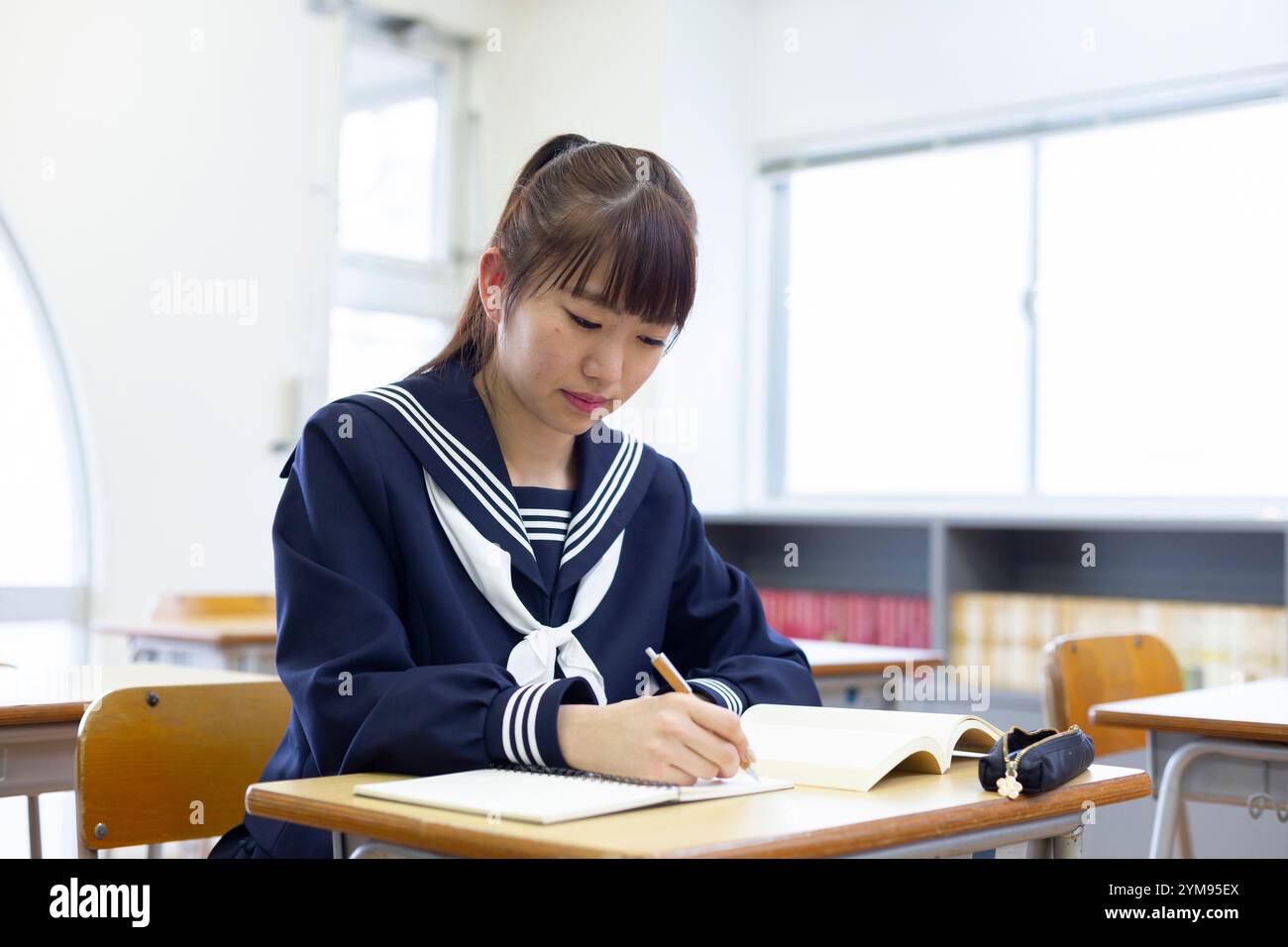 Young Japanese students studying in a classroom Stock Photo - Alamy