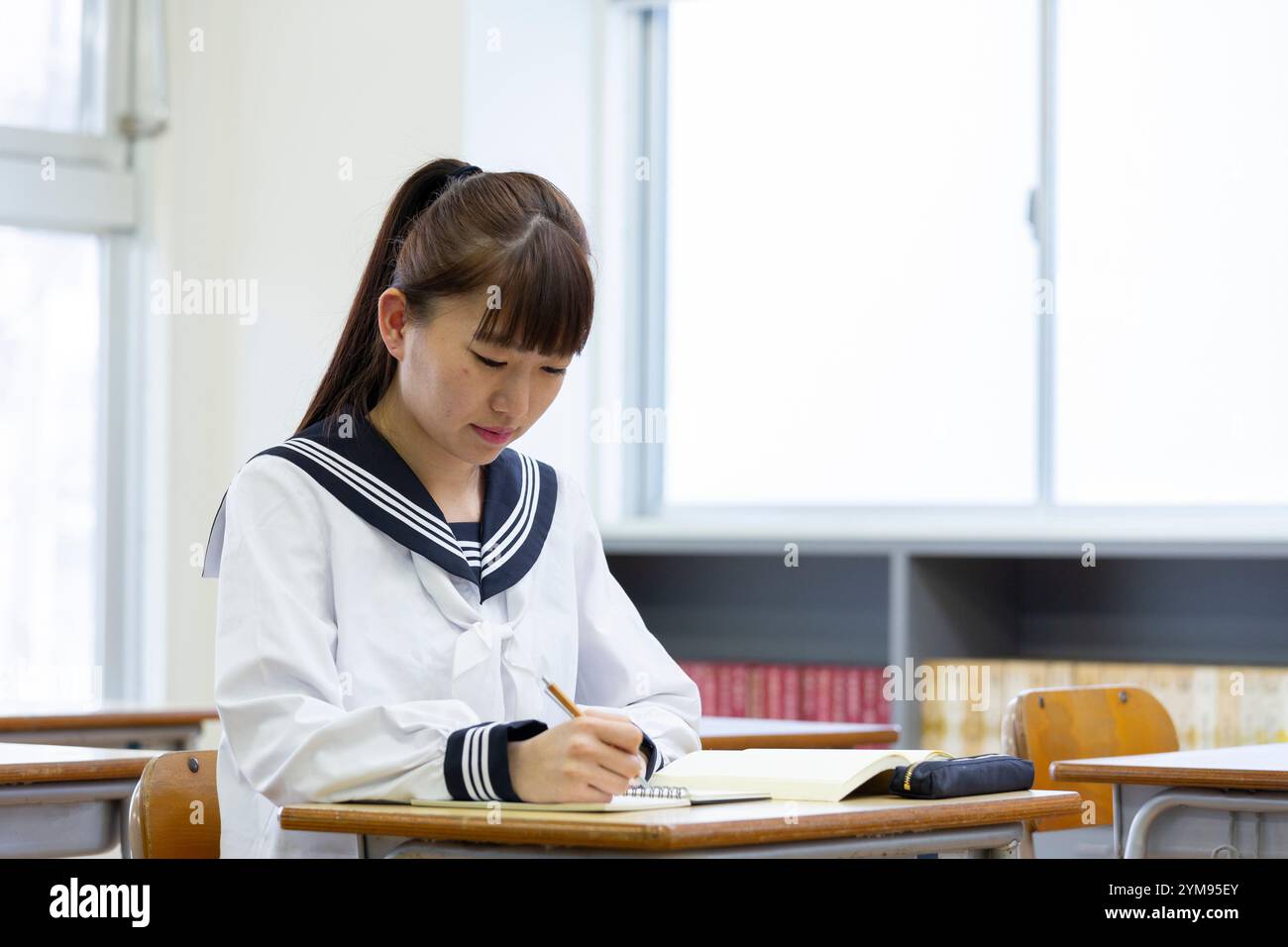 Young Japanese students studying in a classroom Stock Photo - Alamy