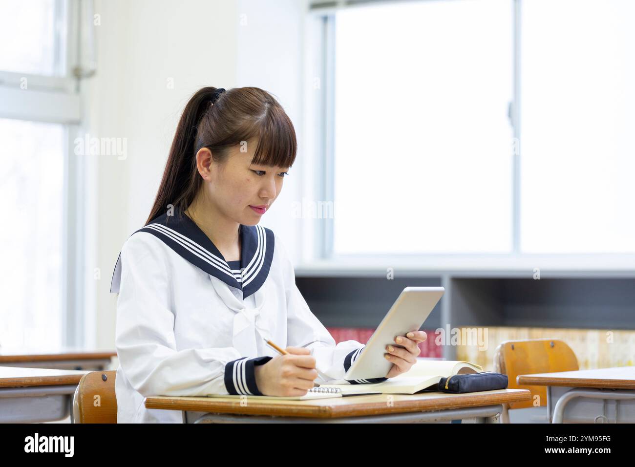 Young Japanese students studying in a classroom Stock Photo - Alamy
