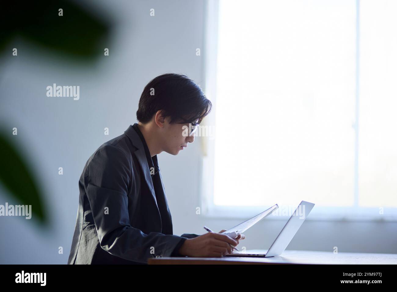 Japanese male architect designing in an architectural office Stock ...
